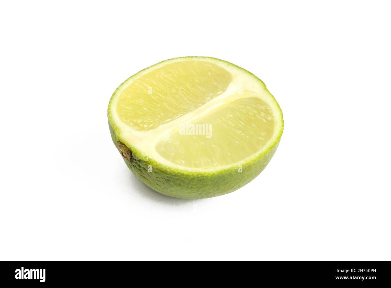 Half the lime isolated on white background. Sliced part of green fruit ...