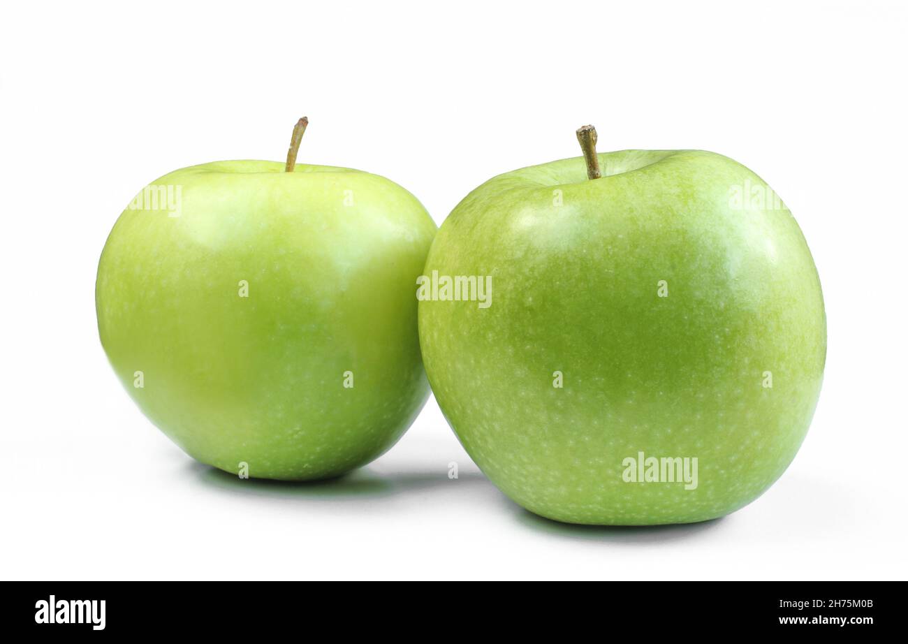 Two whole green apples isolated on white background. Shiny fruits Stock ...