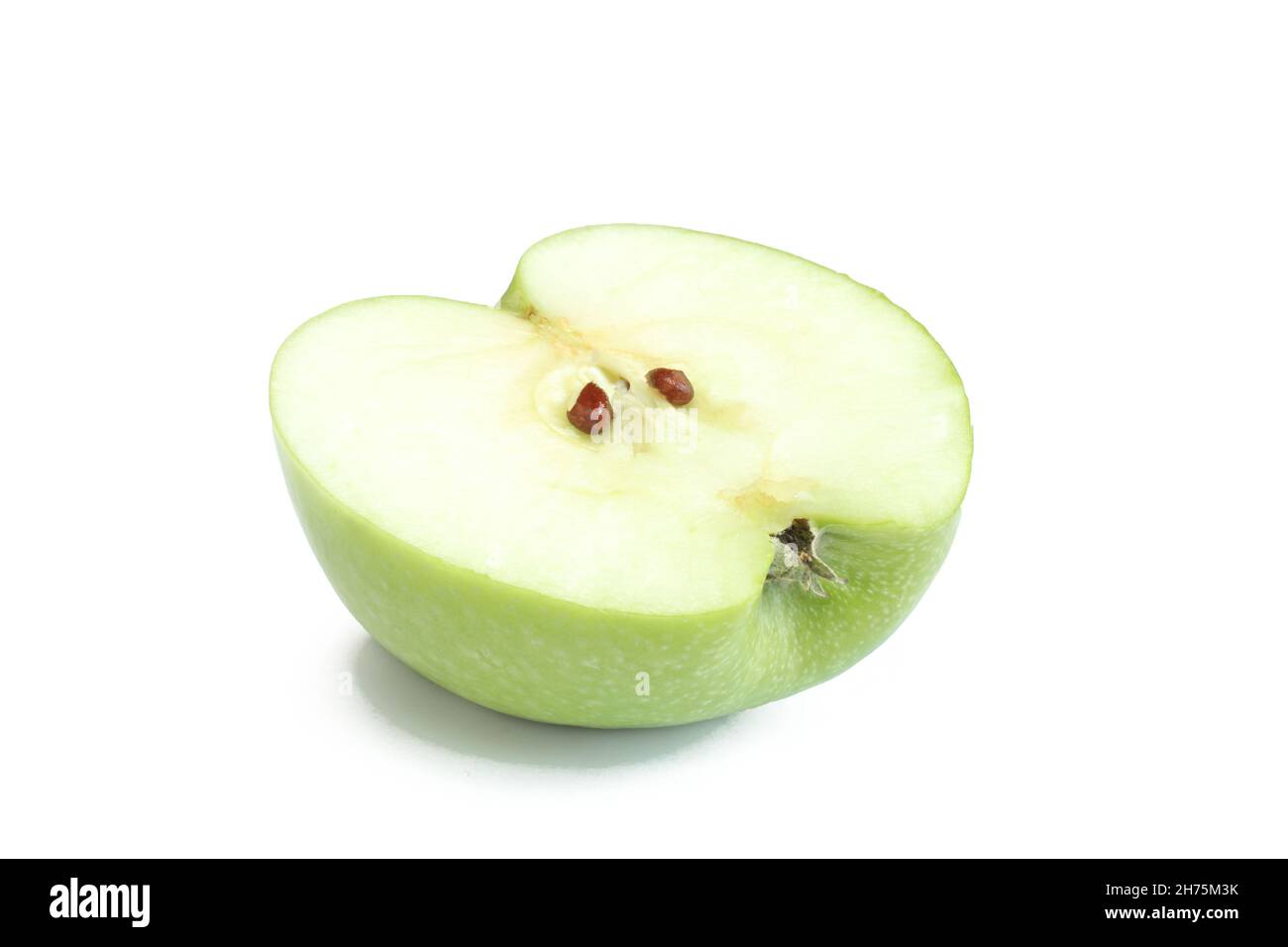 Sliced half of the apple isolated on white background. Green fruit ...