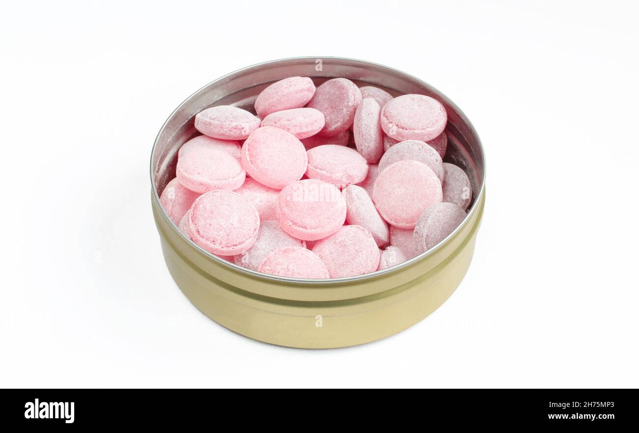 Metallic container full of hard candies isolated on white background ...