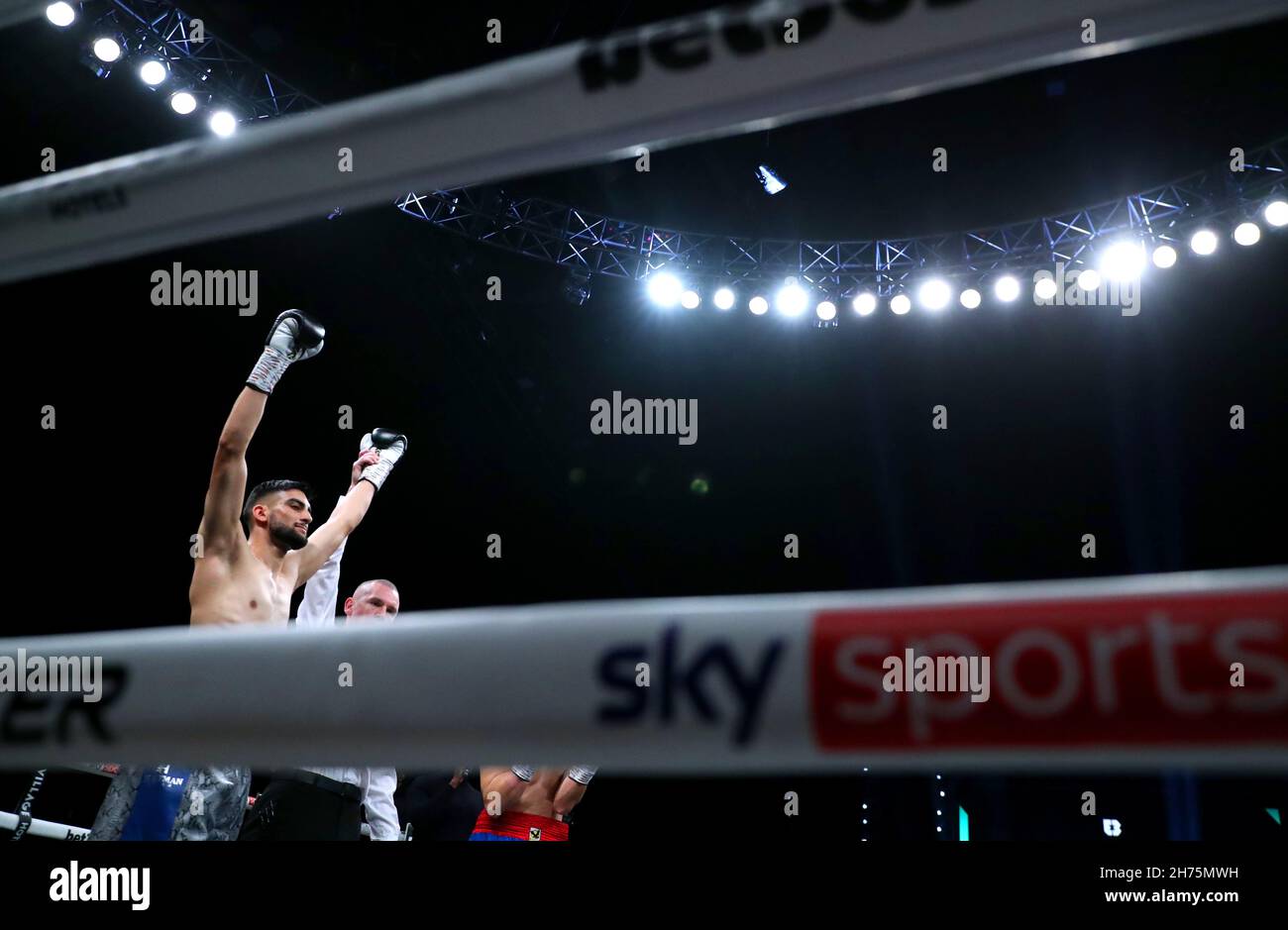 Hassan Azim celebrates after knocking out Ivan Njegac to win the welter ...