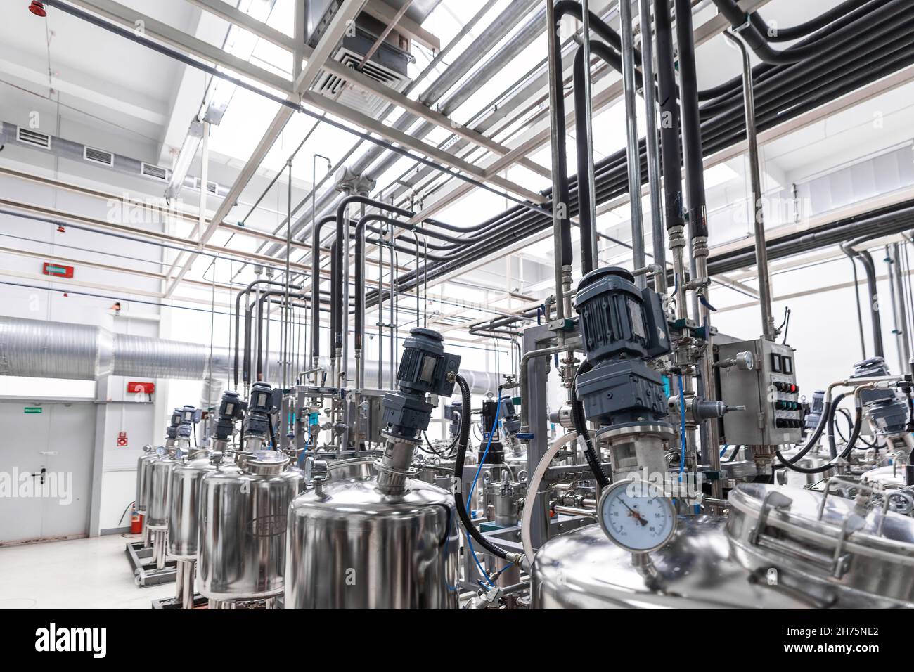 Photo of pipes and tanks. Chemistry and medicine production ...