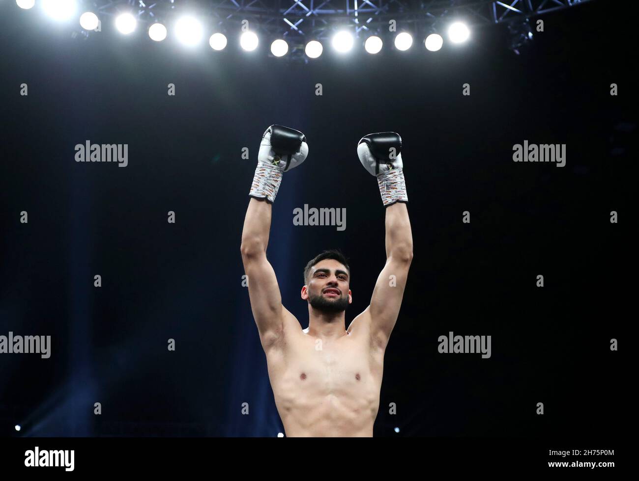 Hassan Azim celebrates after knocking out Ivan Njegac to win the welter ...
