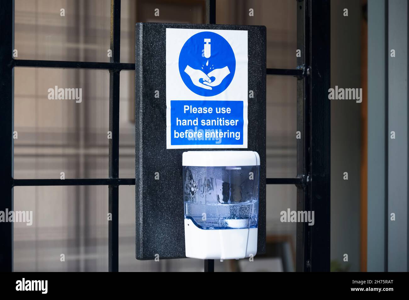 Hand sanitiser dispenser for customer use to wash hands reduce risk of ...