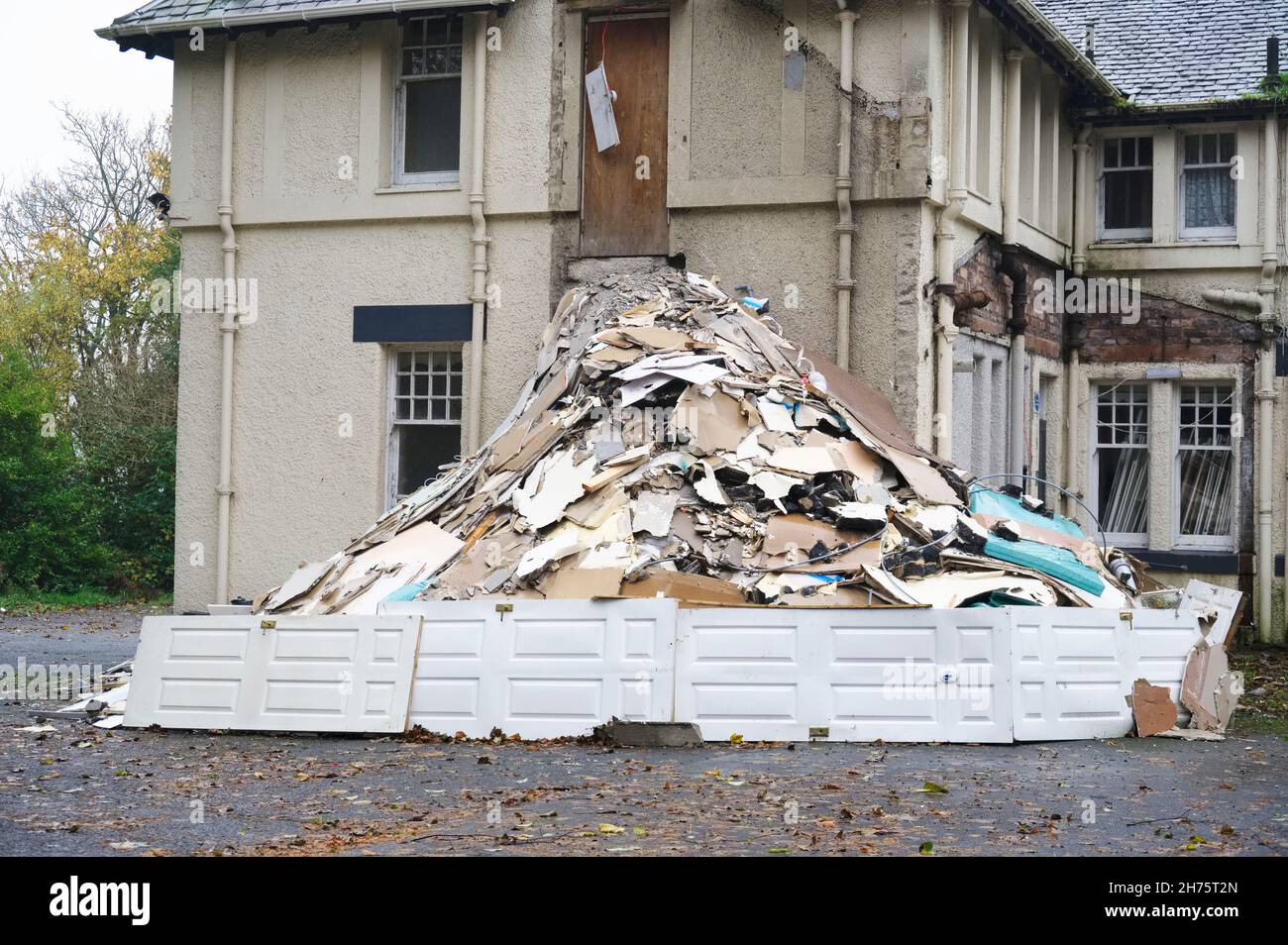Demolition in progress of derelict house on construction building site ...