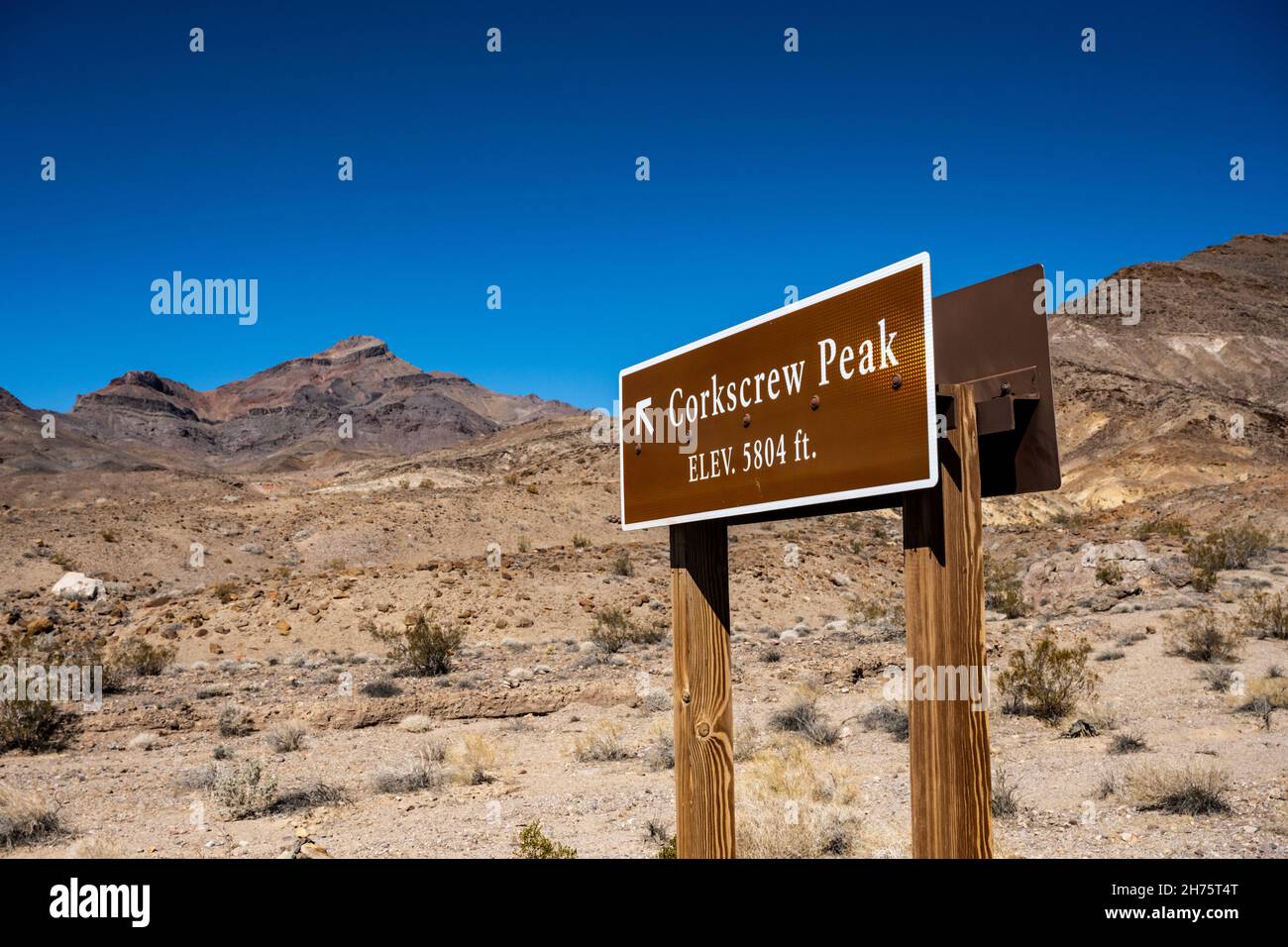 Corkscrew Peak Elevation Sign Pointing Toward The Peak and the ...