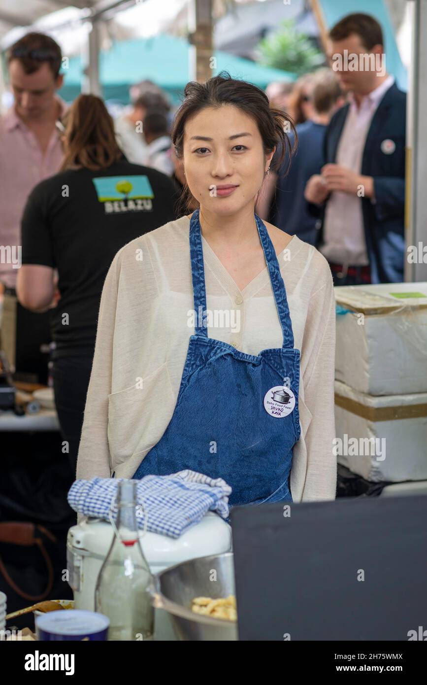 Chef serving up food at Soho Food Feast Stock Photo - Alamy