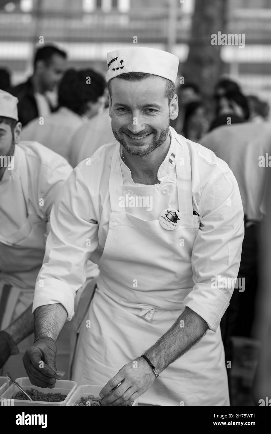 Chef serving up food at Soho Food Feast Stock Photo - Alamy