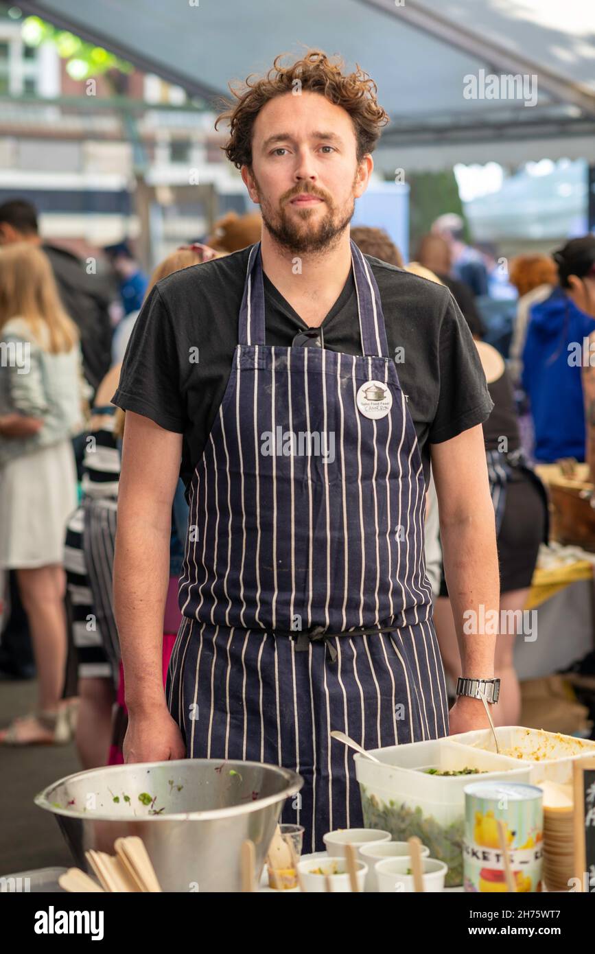 Chef serving up food at Soho Food Feast Stock Photo - Alamy