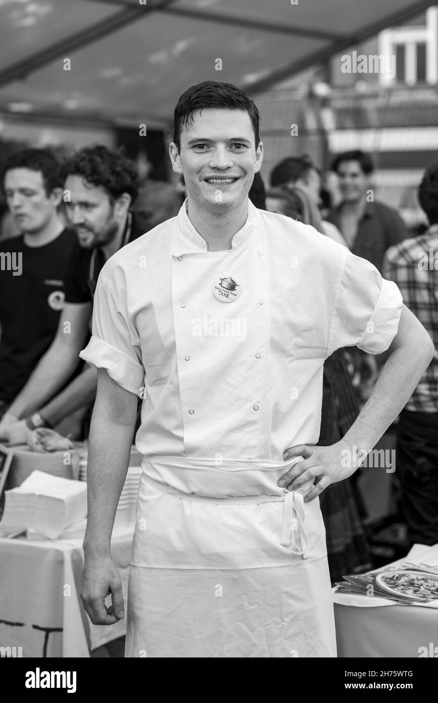 Chef serving up food at Soho Food Feast Stock Photo - Alamy