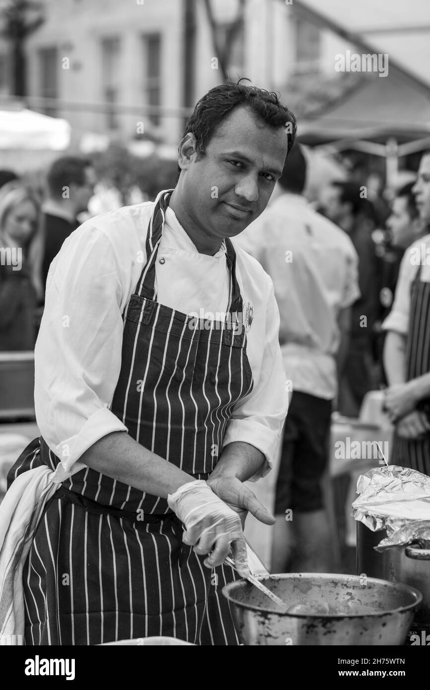 Chef serving up food at Soho Food Feast Stock Photo - Alamy