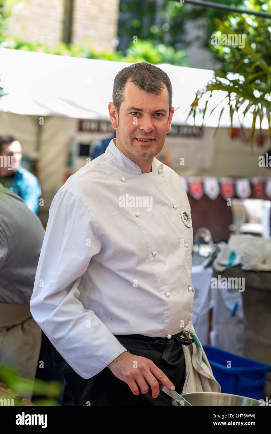 Chef serving up food at Soho Food Feast Stock Photo - Alamy