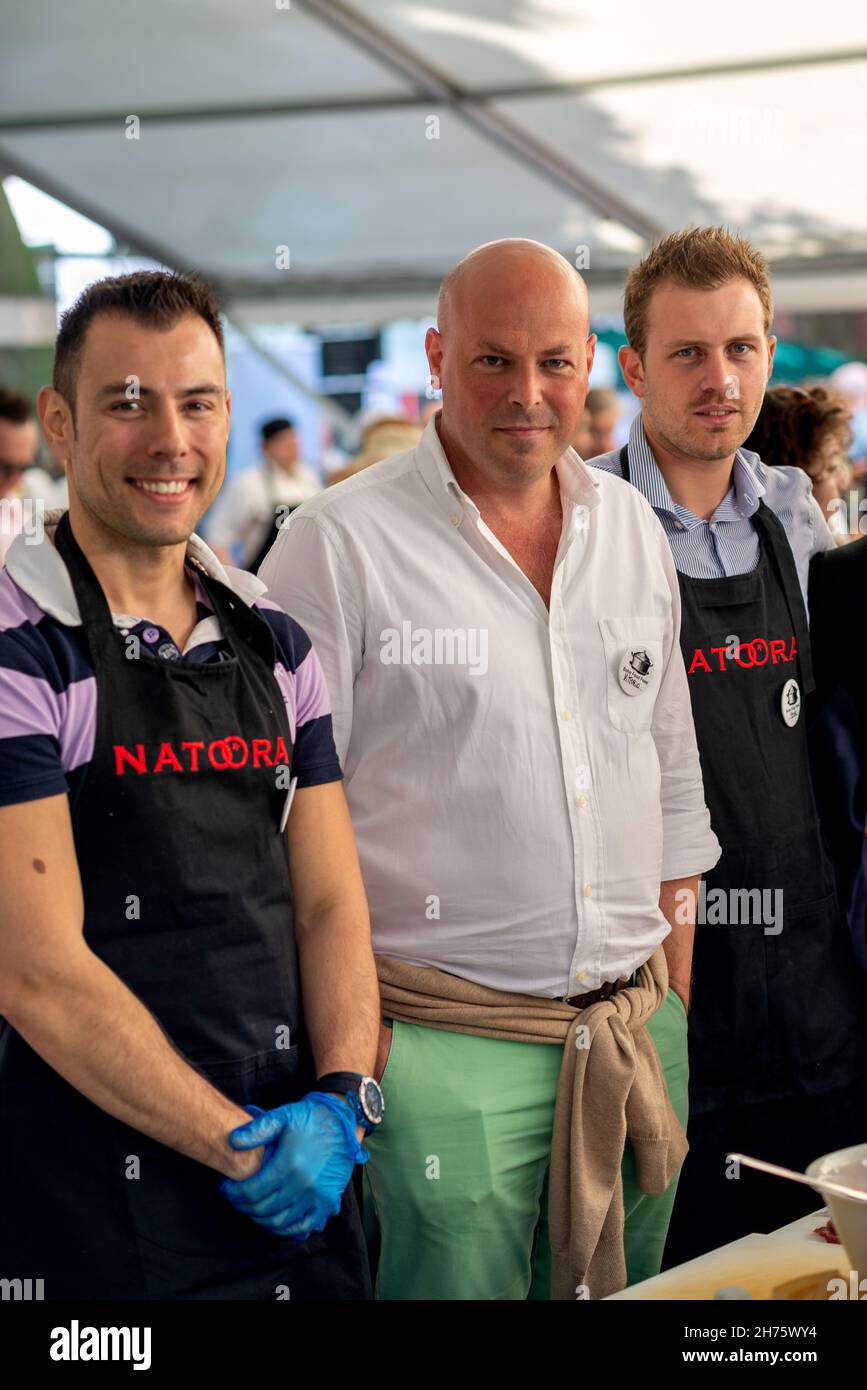 Three chefs serving up food at Soho Food Feast Stock Photo - Alamy