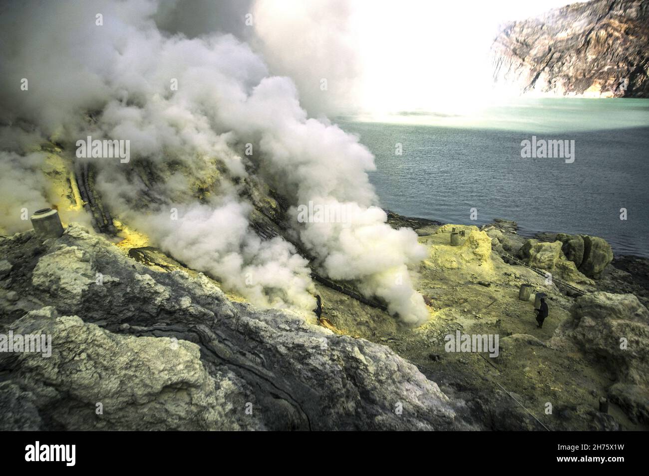Sulfur mining pipe is seen draining molten sulfur in the crater of the ...