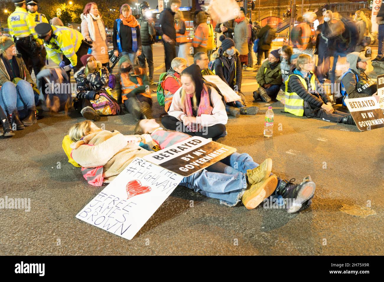 Two women laying on street hi-res stock photography and images - Alamy