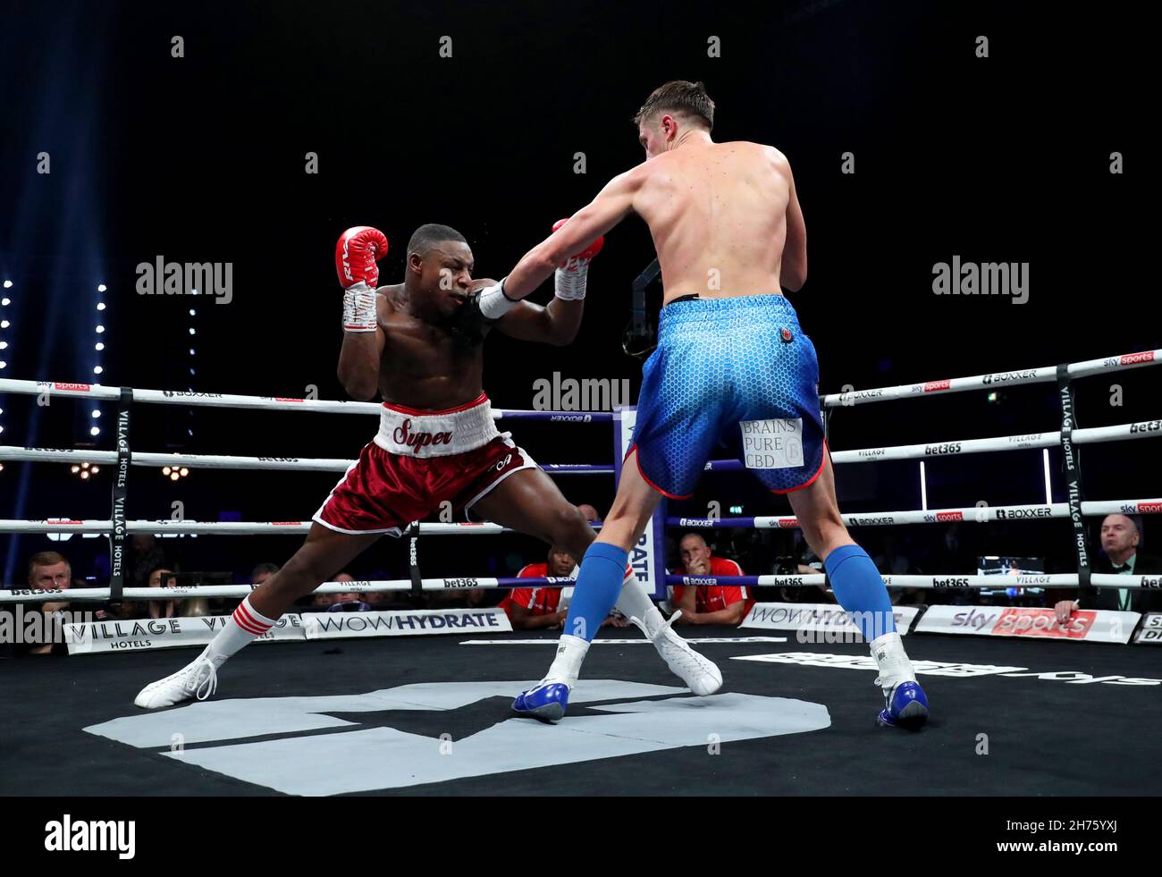 Hosea Burton (right) in action against Dan Azeez in the British Light Heavyweight Title fight ...