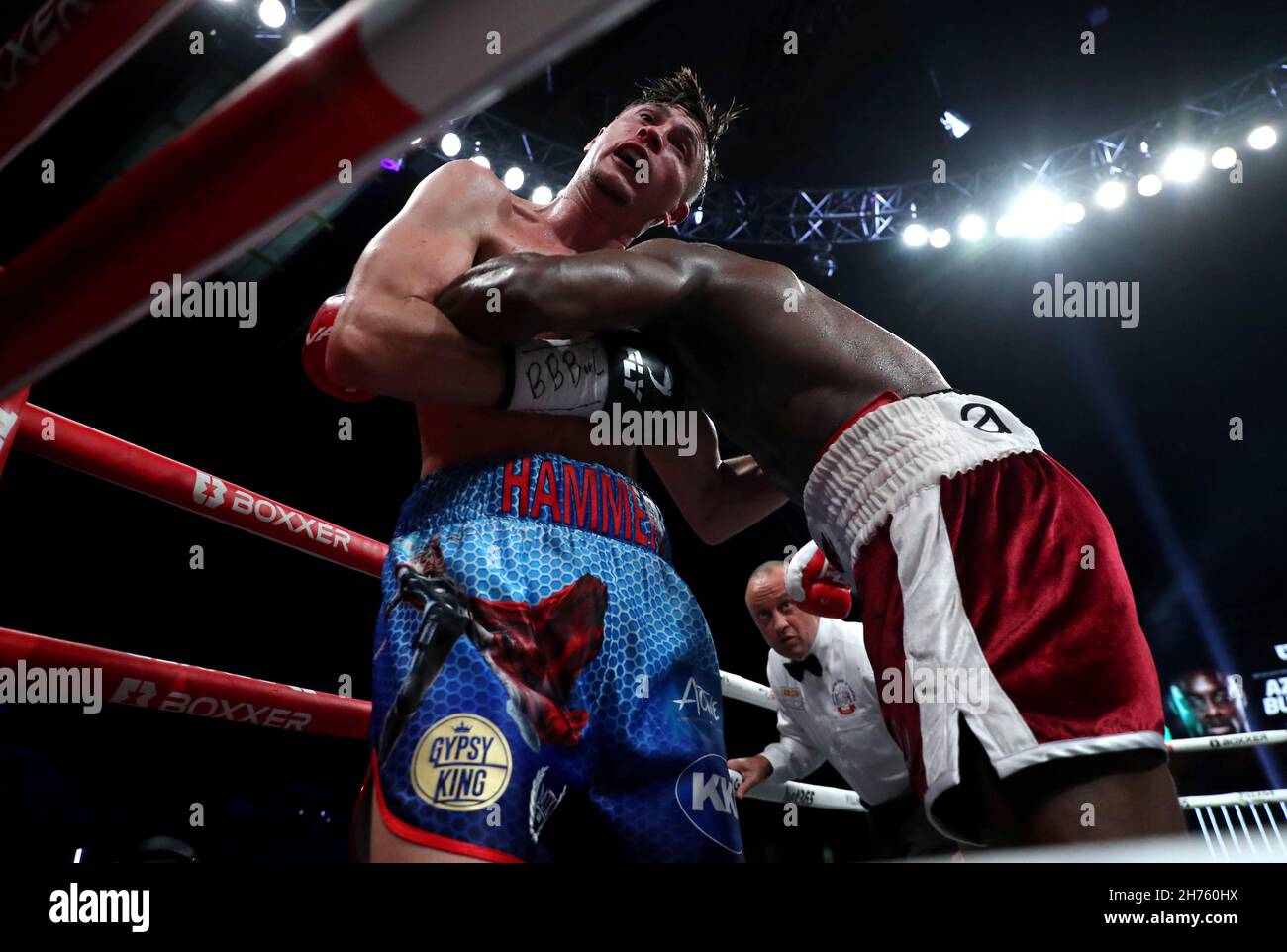 Hosea Burton (left) in action against Dan Azeez in the British Light Heavyweight Title fight ...