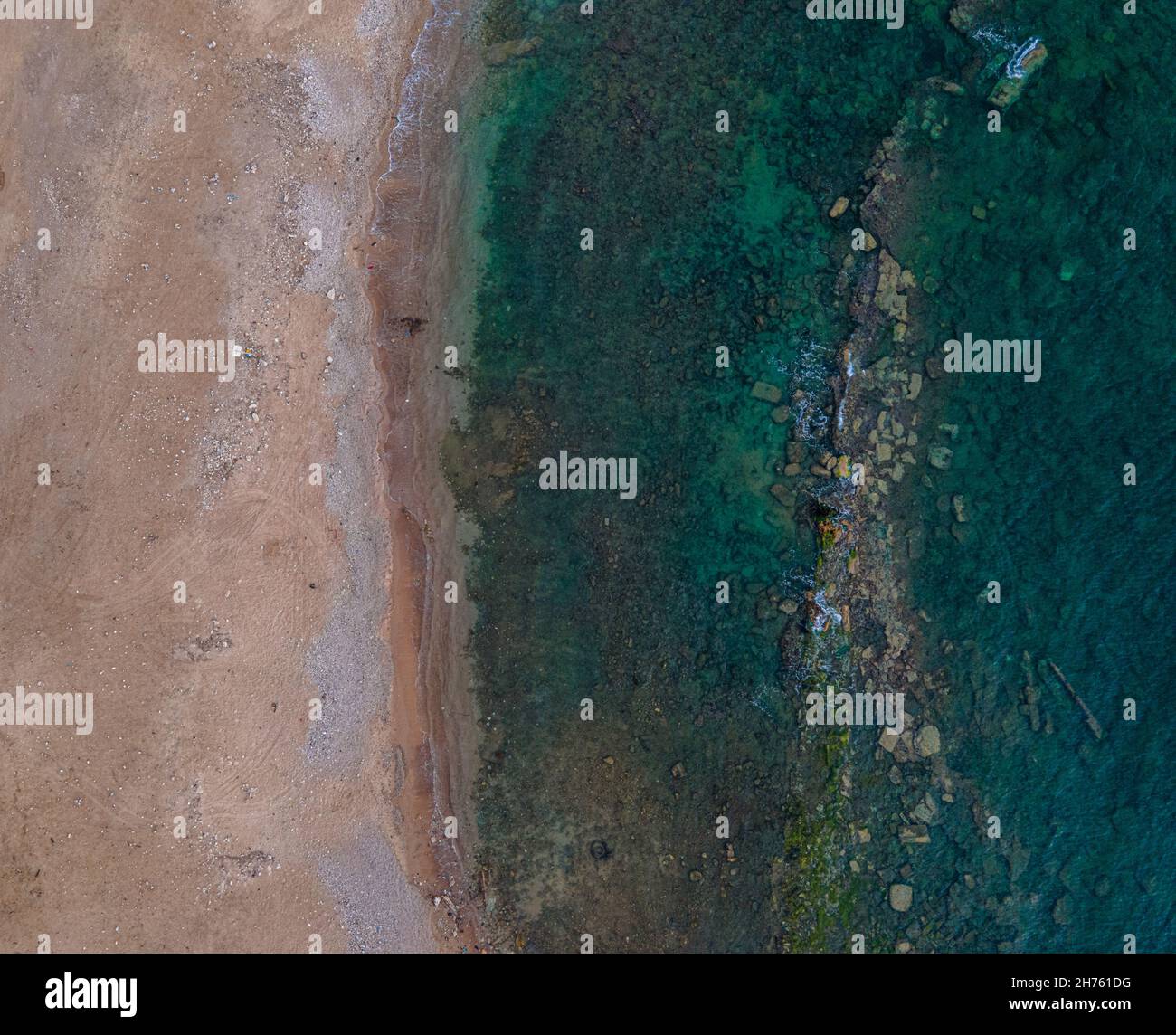 Top view of seashore with large stones Stock Photo - Alamy