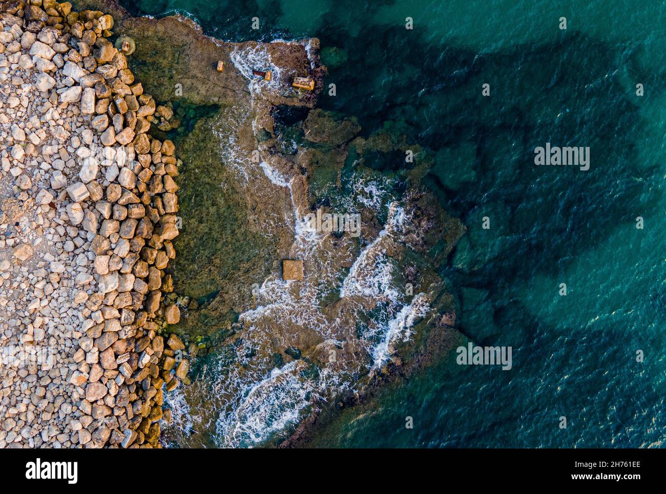 Top view of seashore with large stones Stock Photo - Alamy