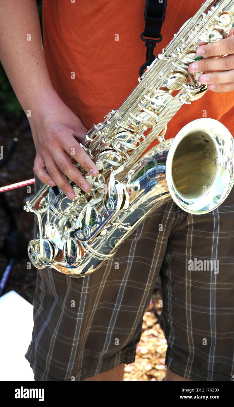 Close-up shot of a jazz saxophone player playing a solo at a concert ...