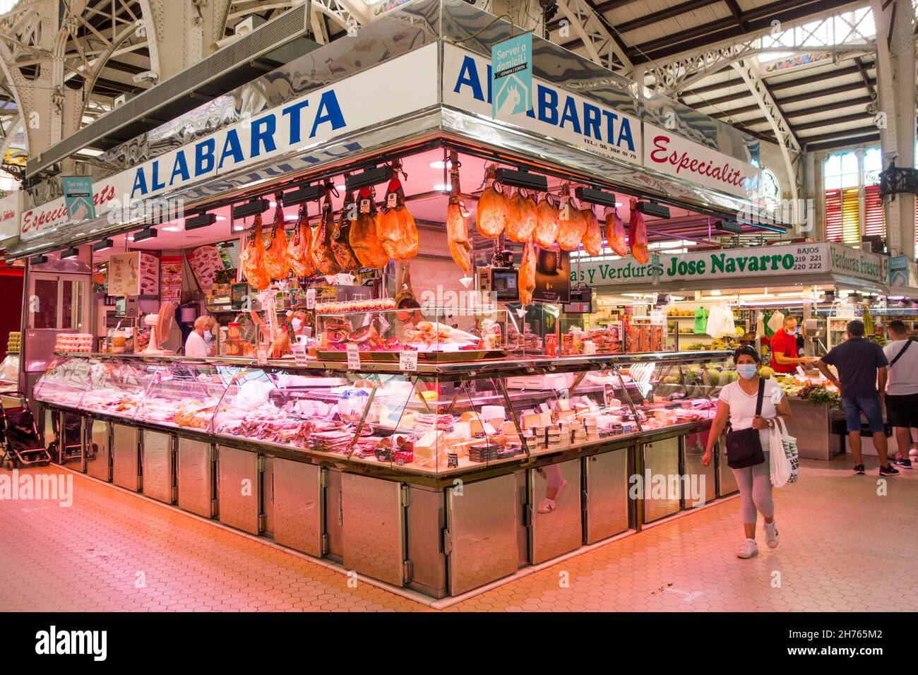 Shoppers at the central food market hall in the Spanish city of ...