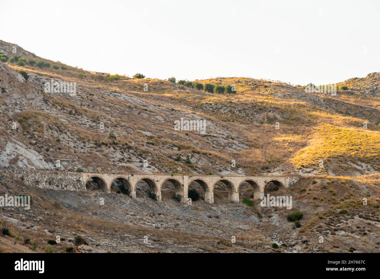 Summer Sicilian landscape including an old aqueduct part of the mining ...