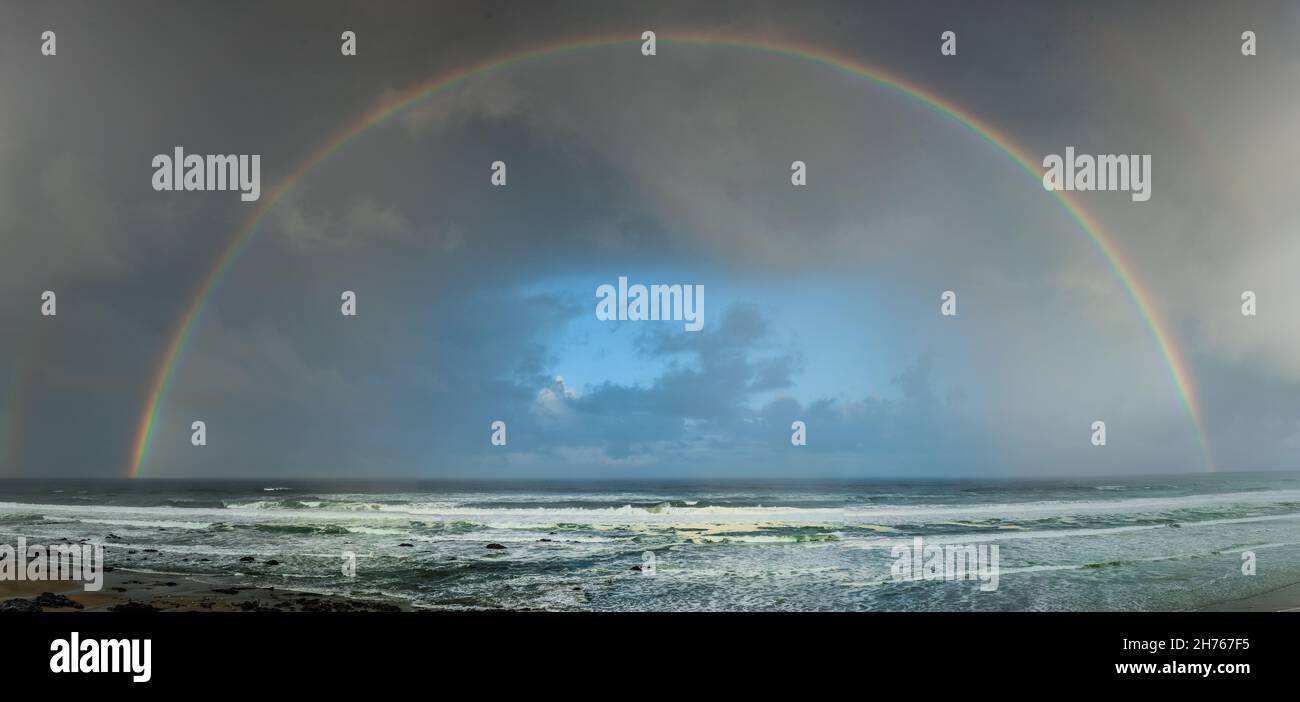 Full rainbow arch above the Pacific ocean on the Oregon coast Stock ...