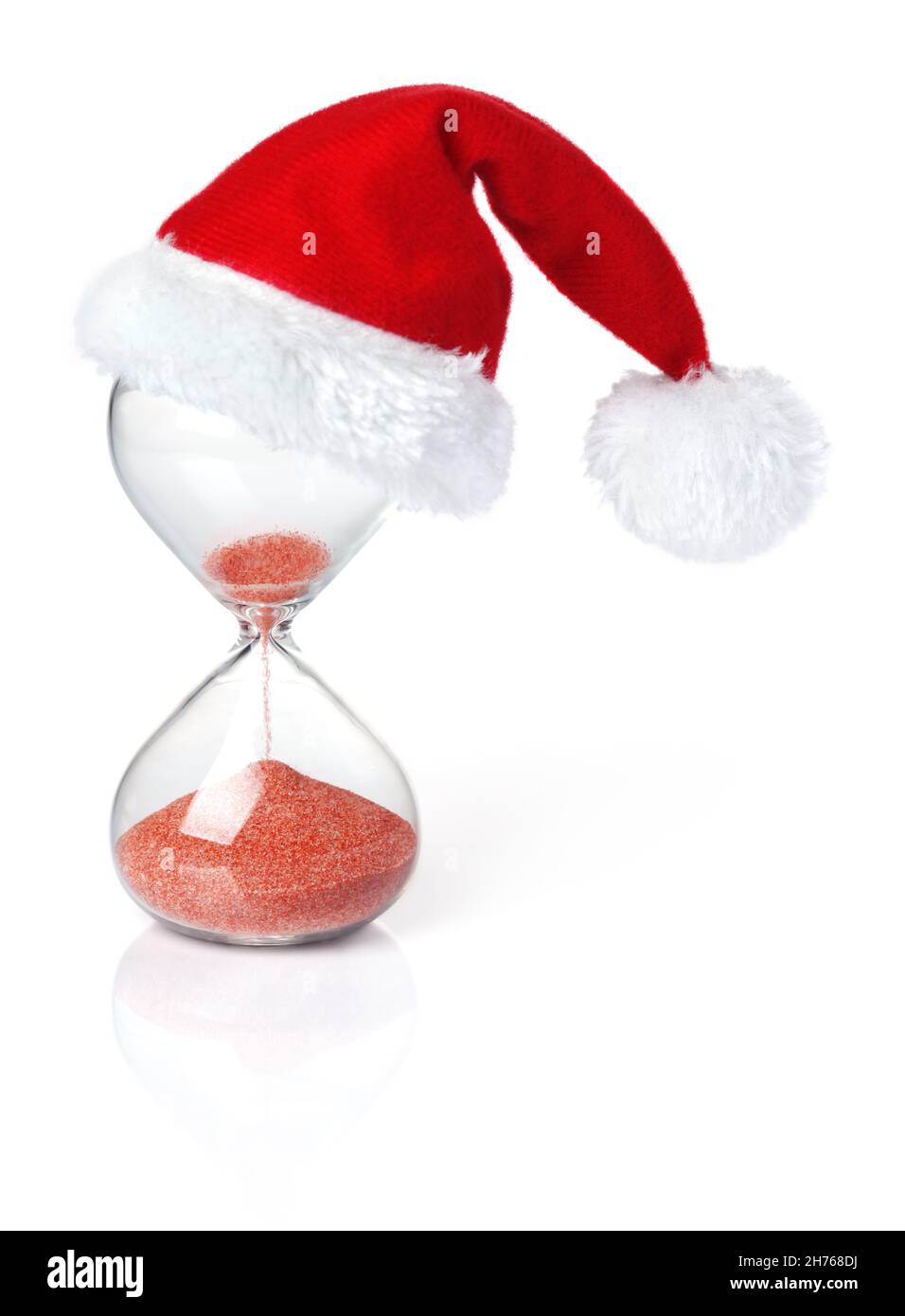 Hourglass with Christmas Santa hat showing the passage of time Stock ...