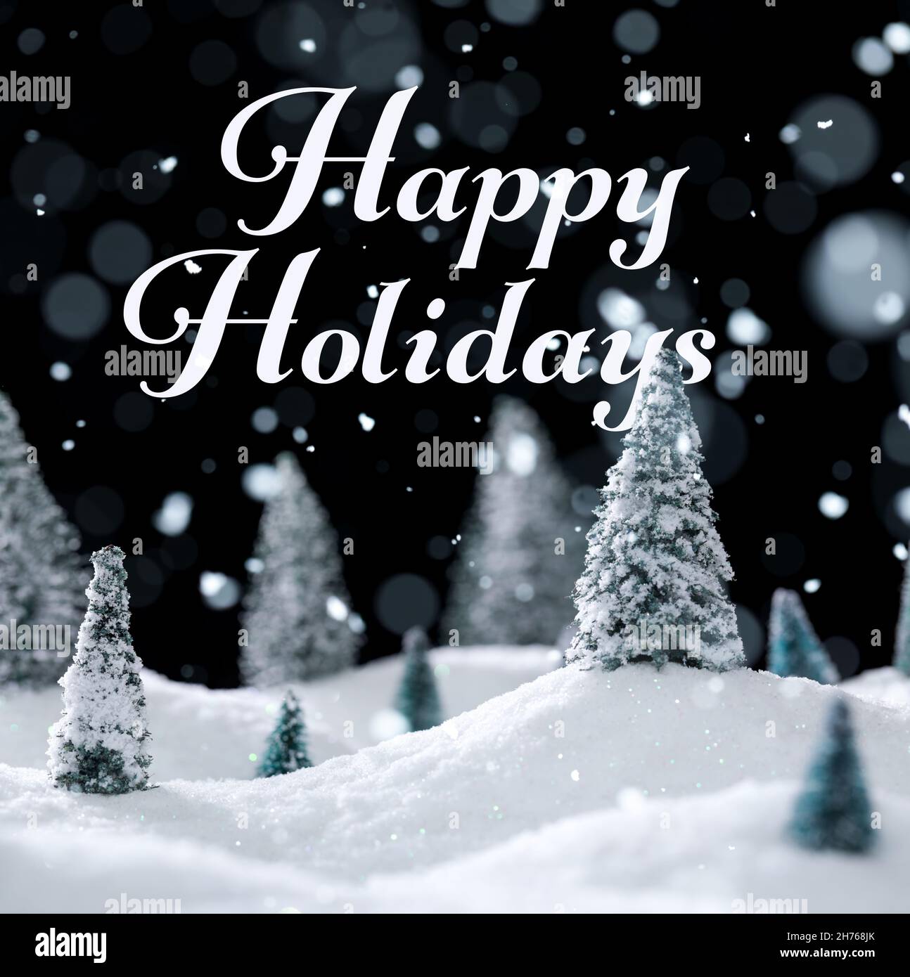 Snowing winter wonderland with trees and sparkling white snow. Happy ...