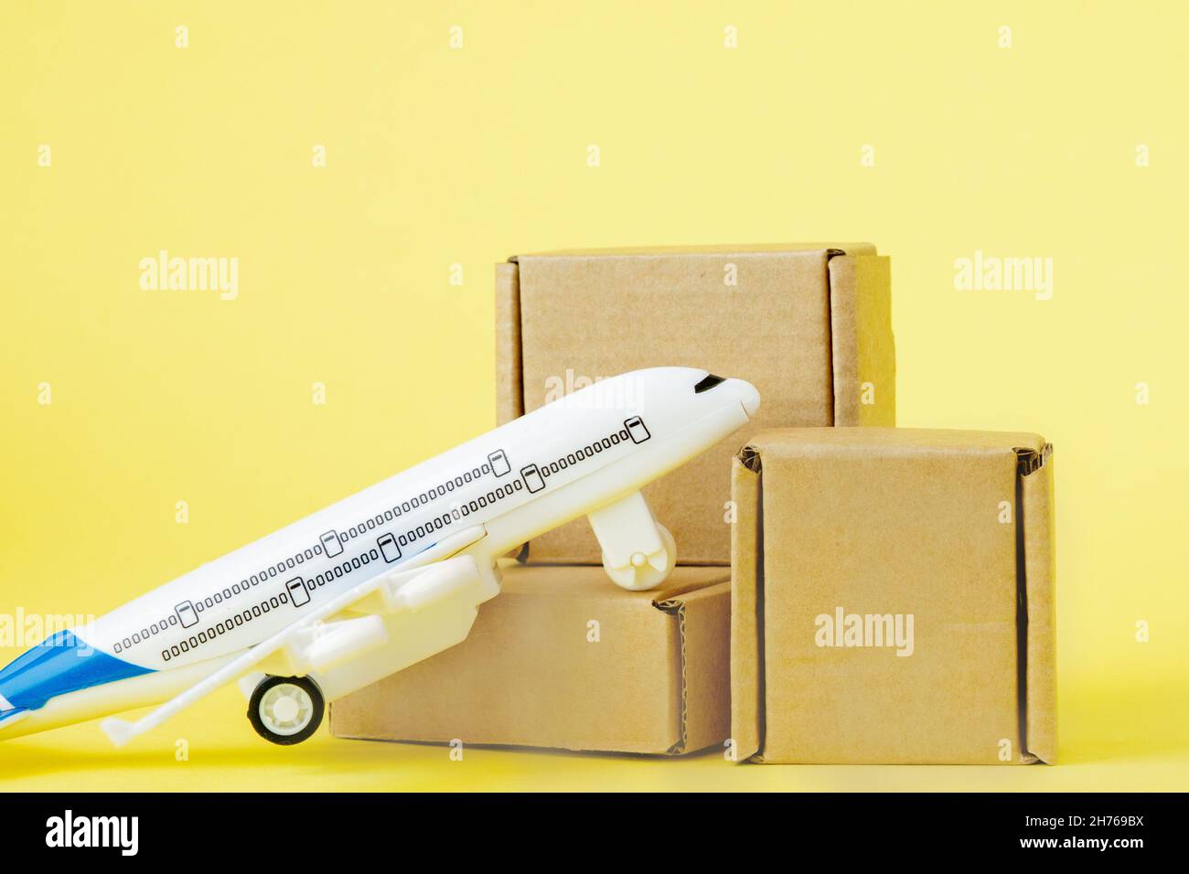 Airplane and stack of cardboard boxes. concept of air cargo and parcels ...