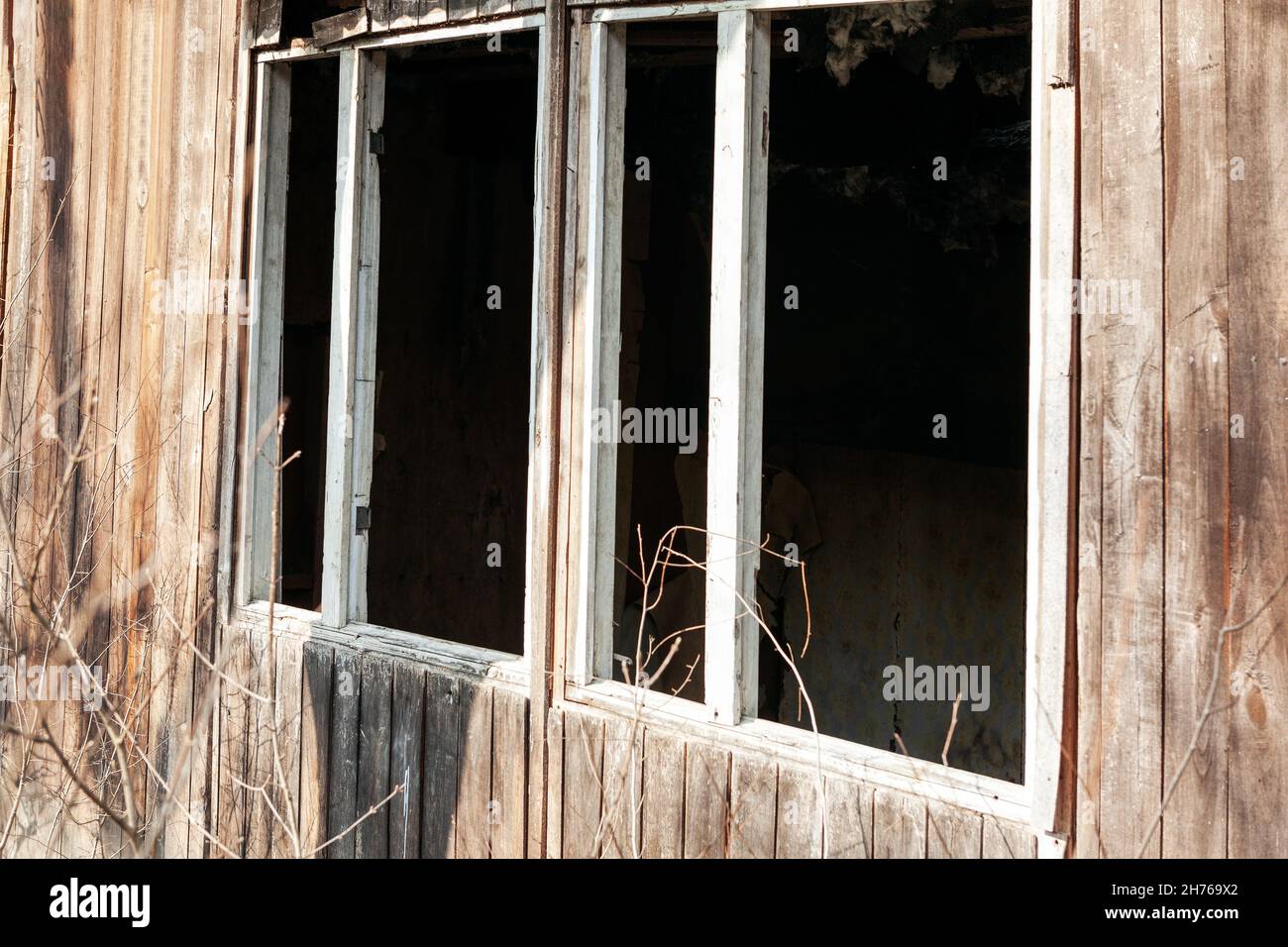 Vintage wooden window frame with broken glass . Wooden wall of ...