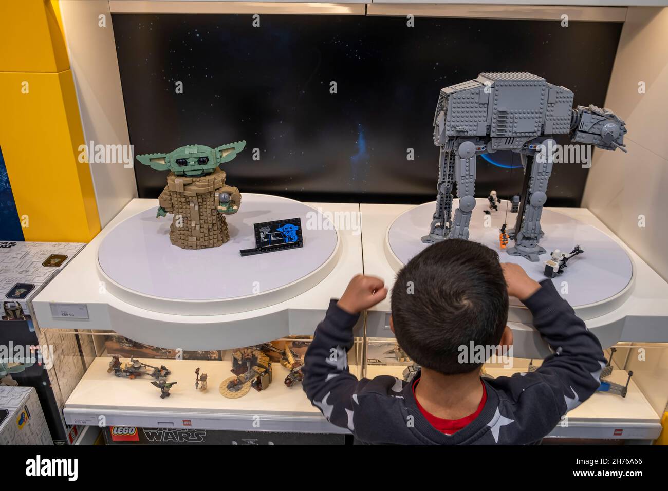 Barcelona, Spain. 20th Nov, 2021. A child is seen contemplating on LEGO ...