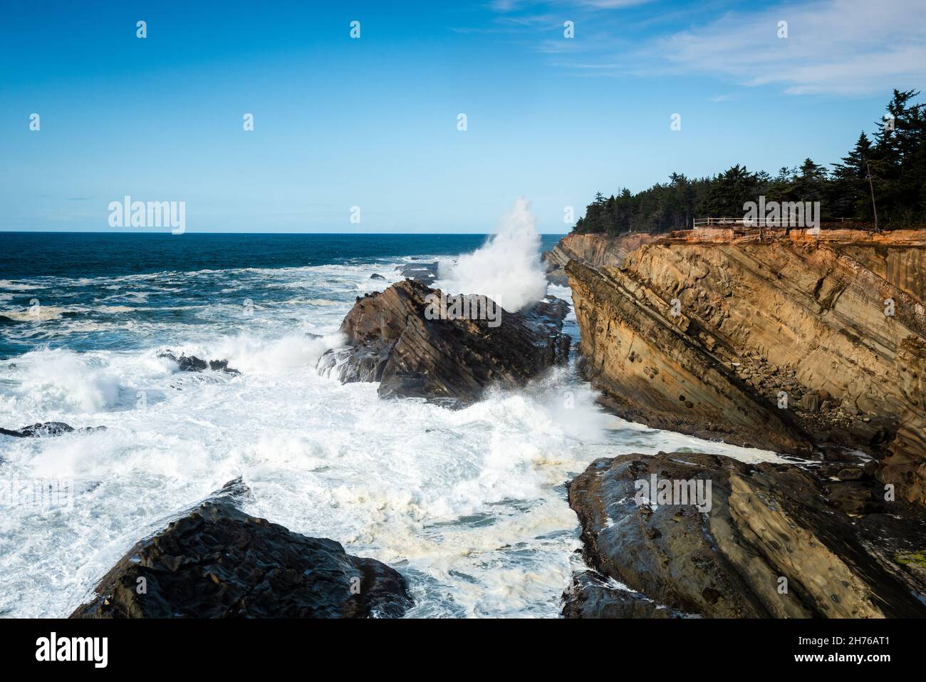 Waves assaulting Shore Acres cliffs Stock Photo - Alamy