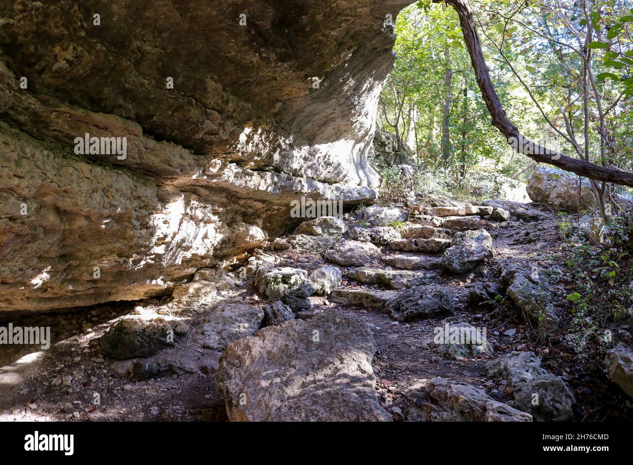 A limestone rock formation along a hiking path in Mother Neff State ...