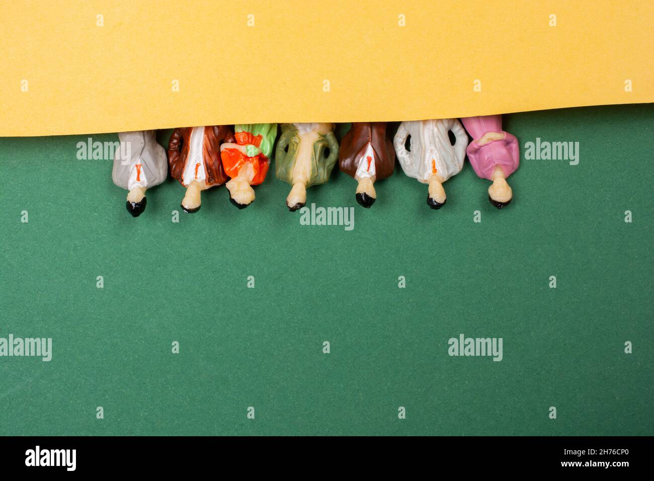 Colorful diverse miniature people figurines make crowd on ground Stock ...