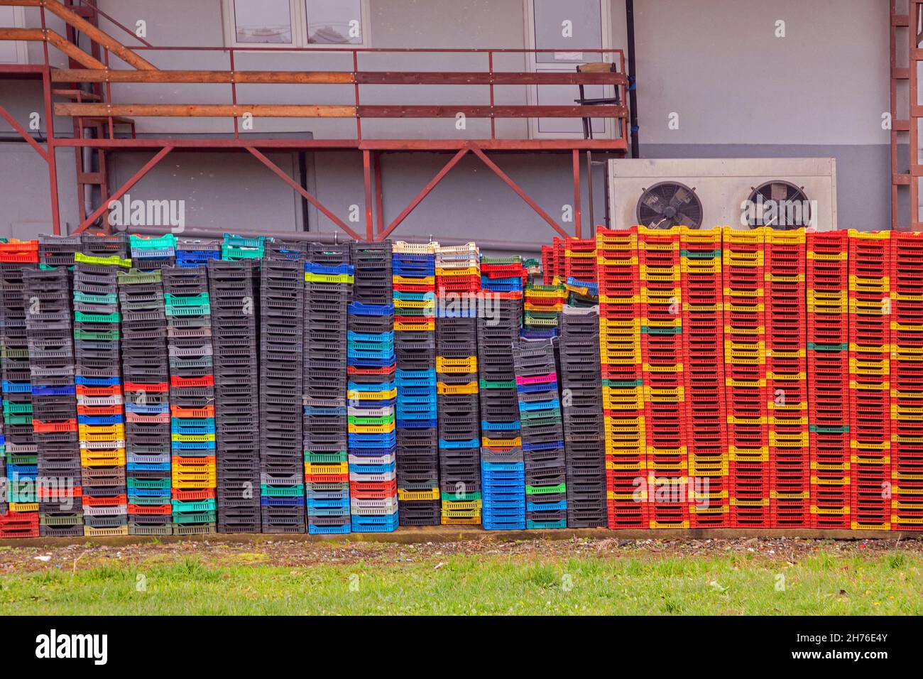 Large pile of colorful empty plastic crates in warehouse outdoors Stock ...