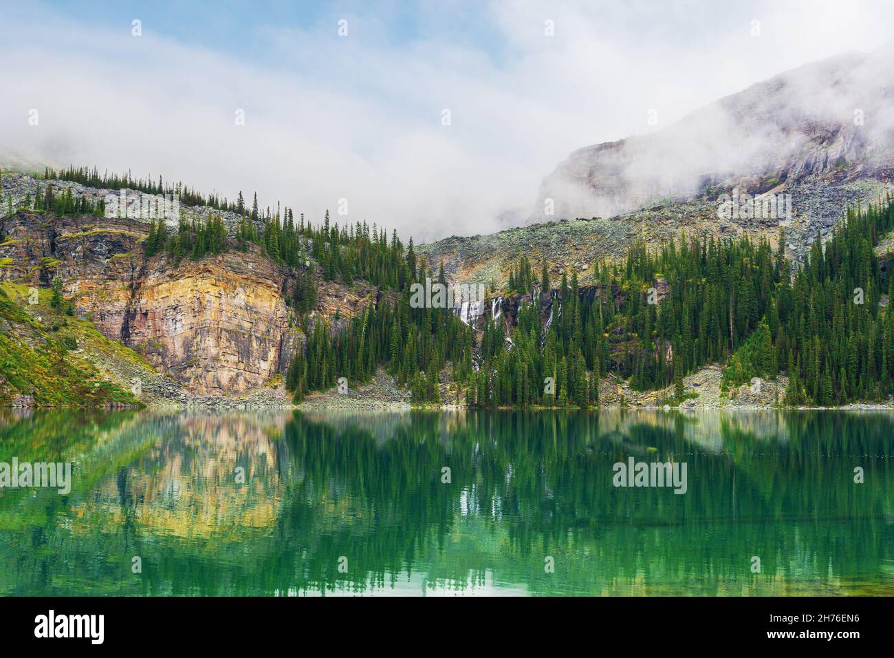 Heavy clouds shroud Mount Lefroy with Seven Veils Falls seen on ...