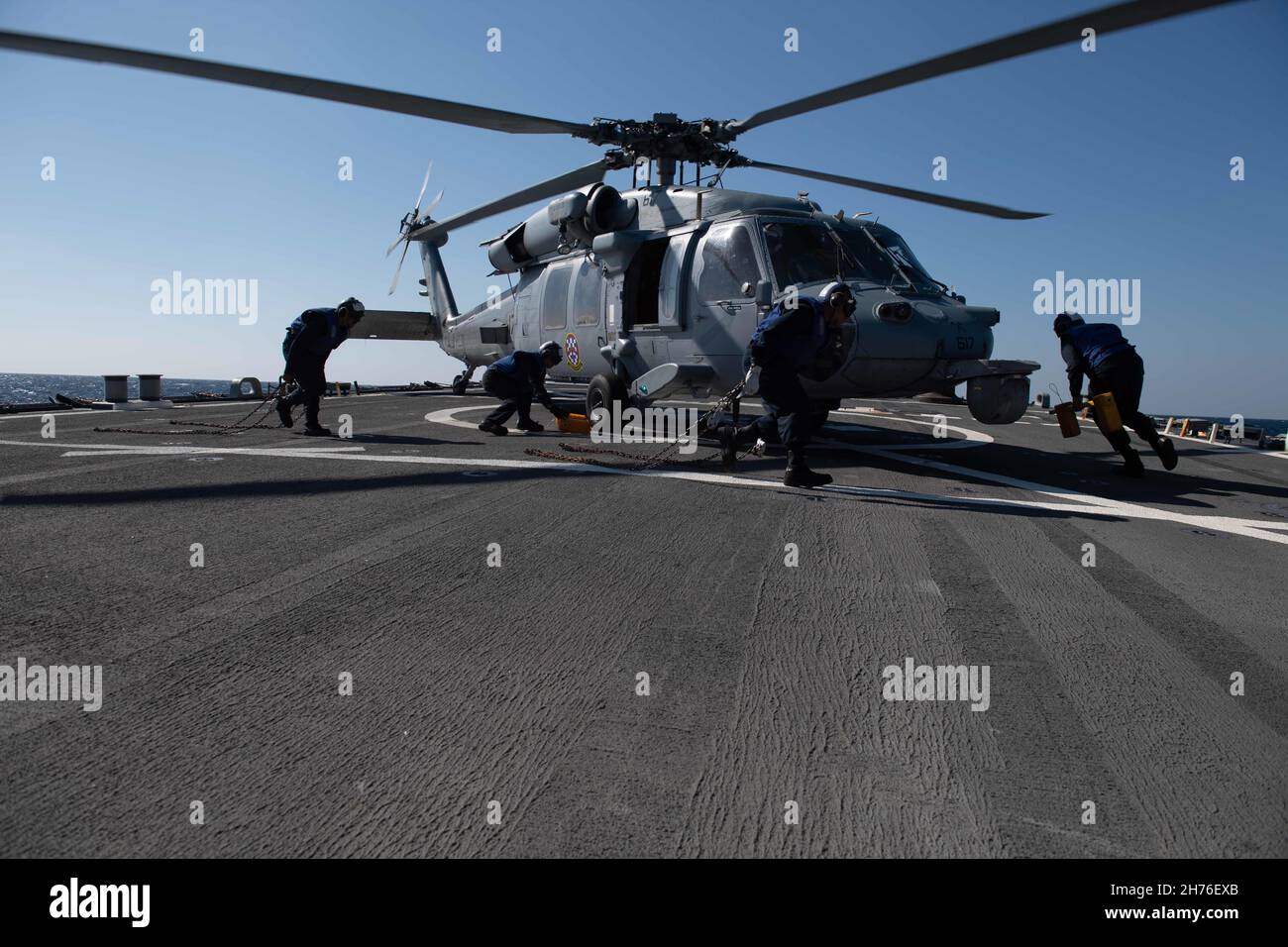211119-N-TC847-1356 EAST CHINA SEA (Nov. 19, 2021) Sailors choke and ...