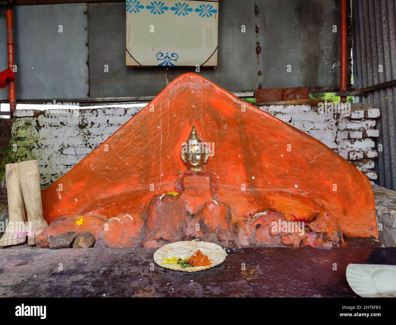 The ancient lord Mhasoba copper face mural on orange color painted ...