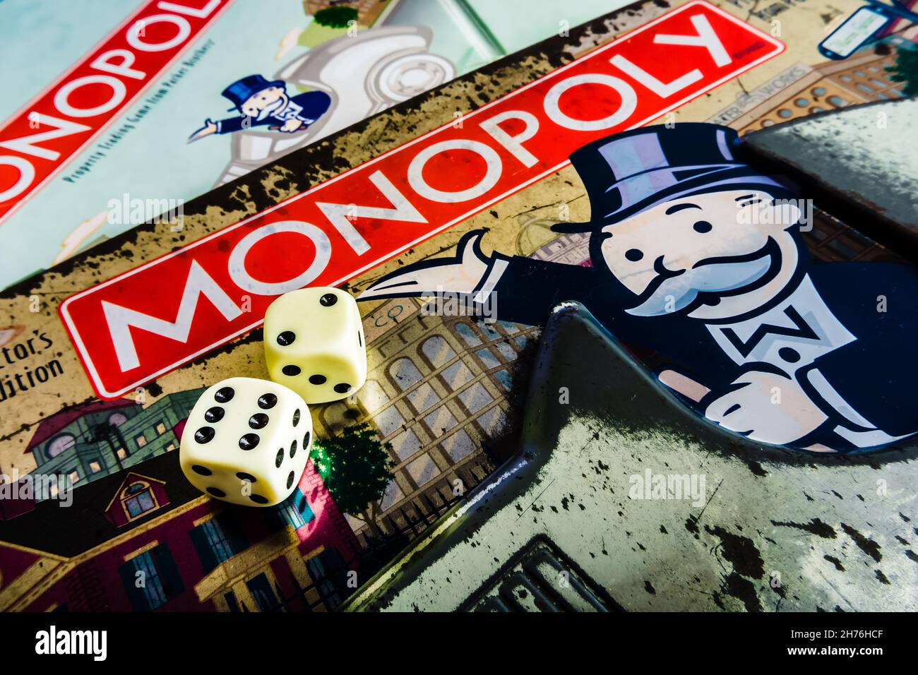 Monopoly Board Game close up with the box, board and dices. The classic ...
