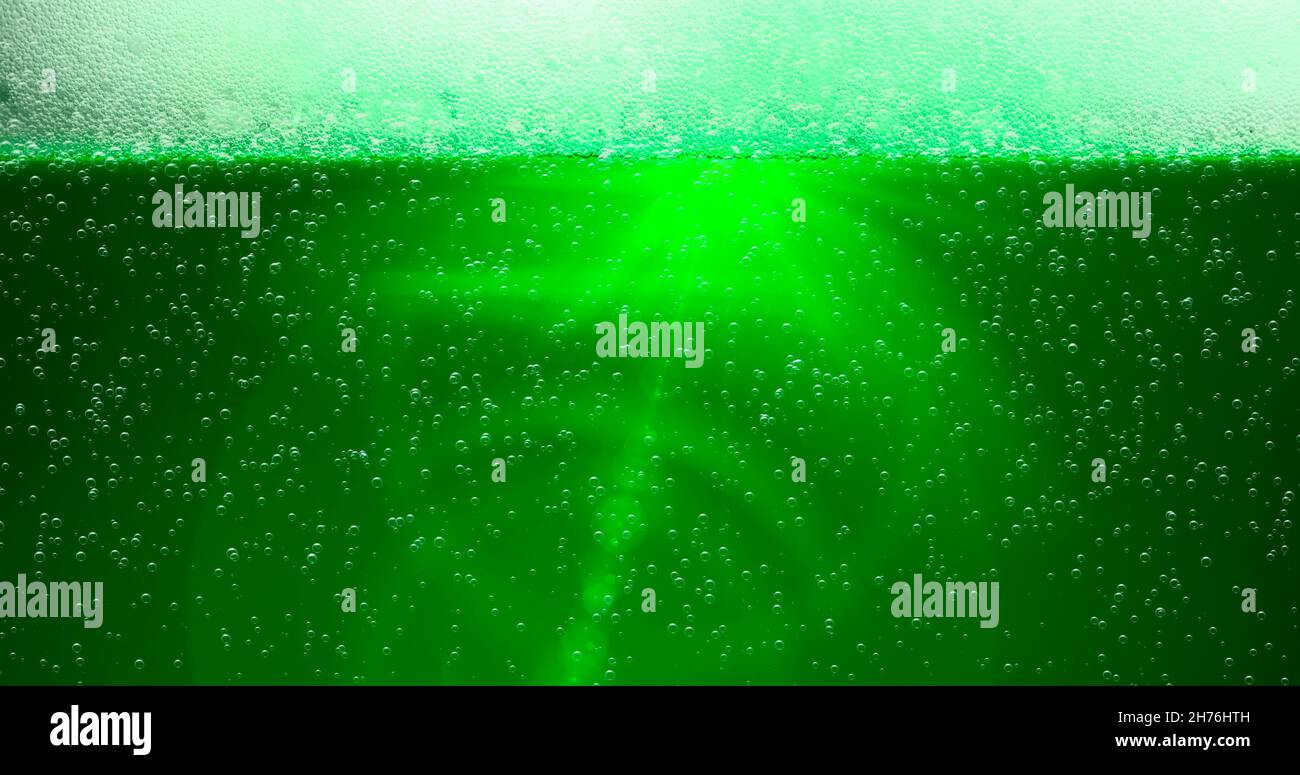 St. Patrick's Day Green Beer background with lens flare. For festive ...