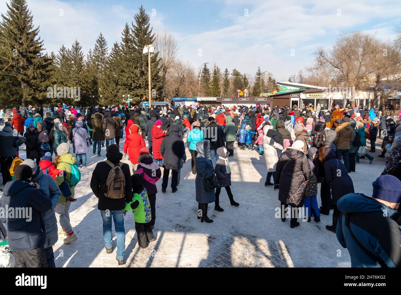 A crowd of townspeople of different ages gathered on the square in the ...