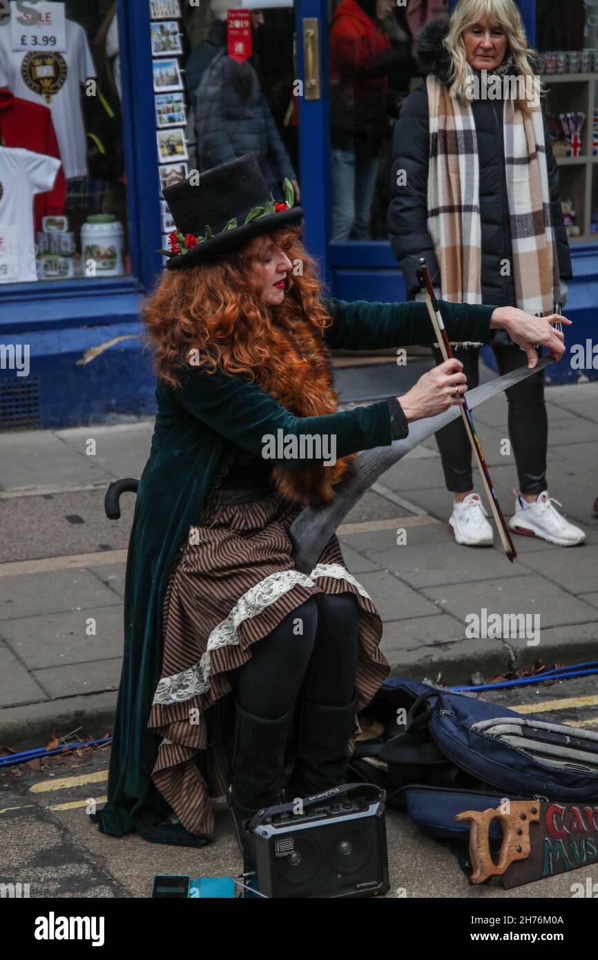 Woman playing the saw hi-res stock photography and images - Alamy