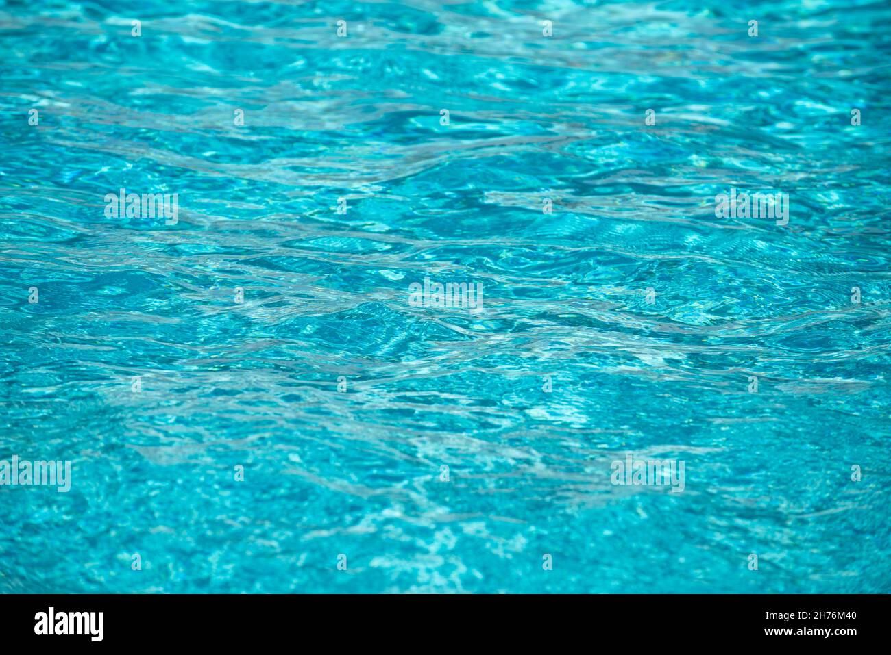 Abstract ripple wave and clear turquoise water surface in swimming pool ...