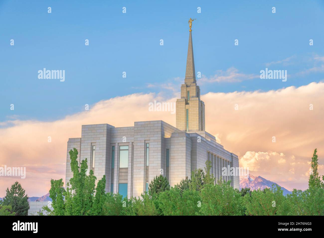 Top exterior of an LDS church with golden statue on top of the steeple ...