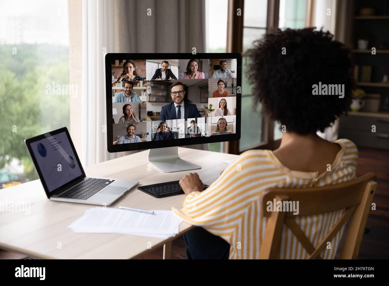 African American distant worker meeting, negotiating with office team ...