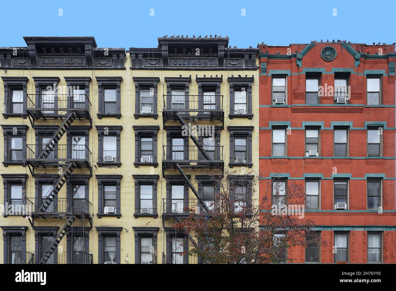 Old fashioned Manhattan apartment building facades with external fire ...