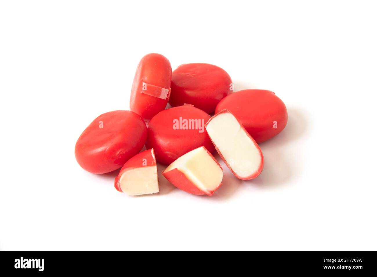 Mini Edam cheese loafs on a white background Stock Photo - Alamy