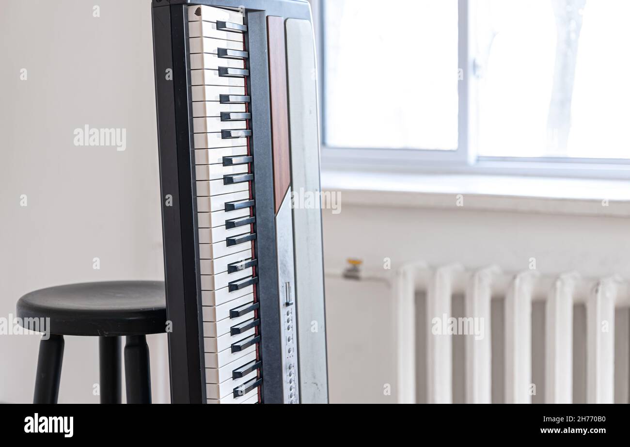 Piano keys in the interior of a bright room Stock Photo - Alamy