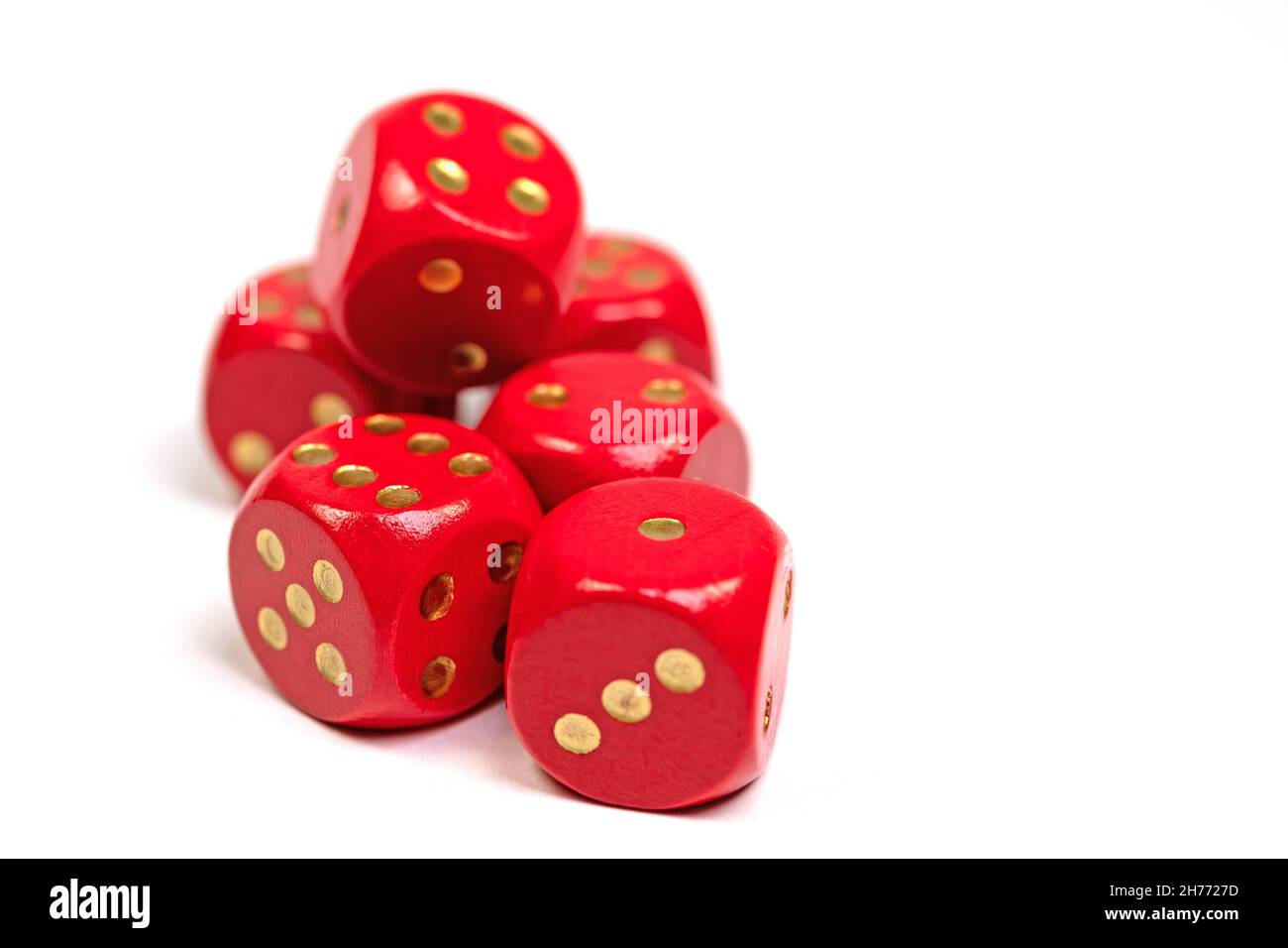 Red wooden dice against white background Stock Photo - Alamy